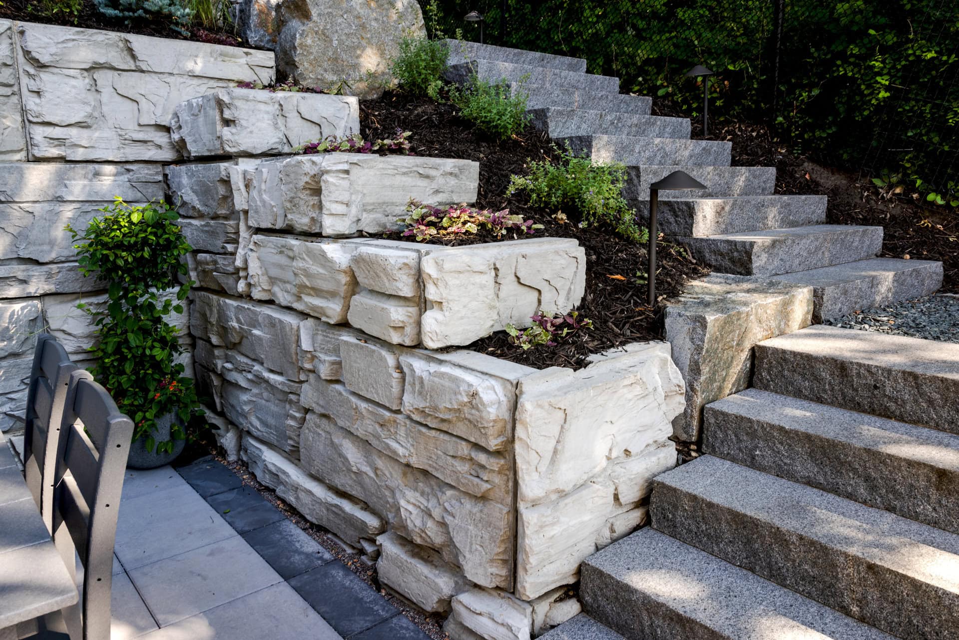 Terraced MagnumStone Walls Convert Steep Hillside to Modern Backyard Design